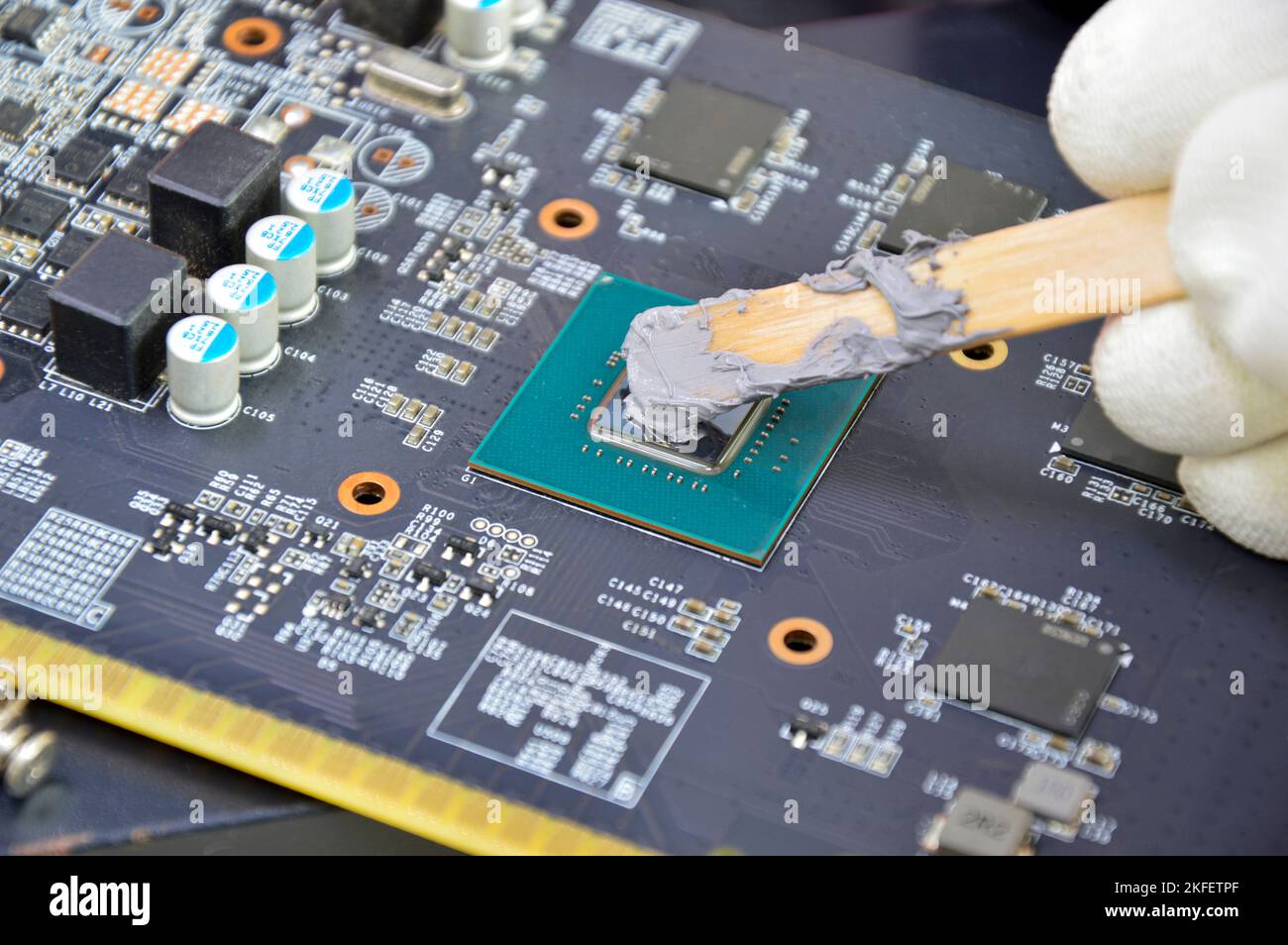 The image of a technician filling a silicon cooling chip CPU Stock ...