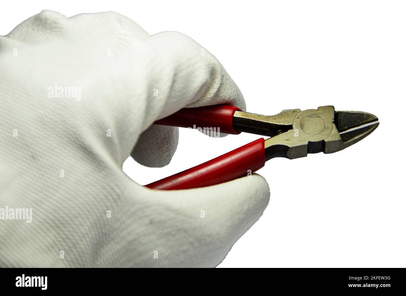 Hand holding the red cutting pliers (with clipping path Stock Photo - Alamy