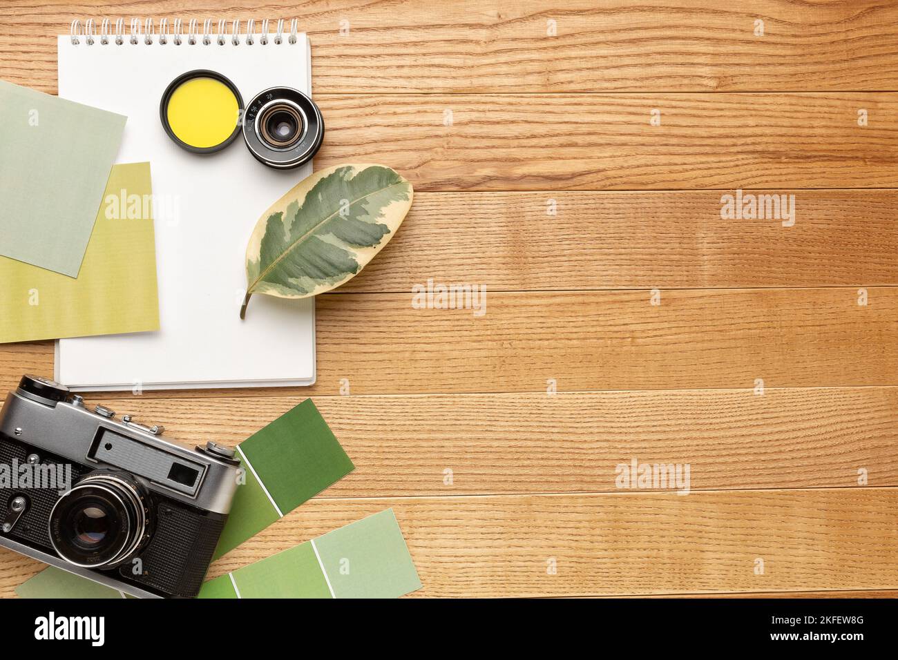 Photographer's desk made of wood with a camera and palettes. High ...