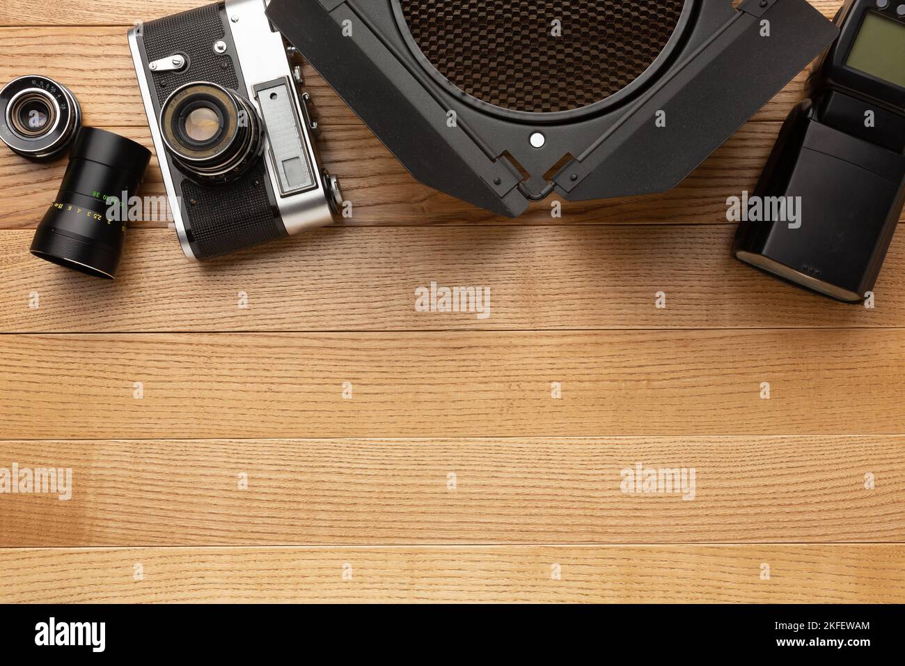 Photographer's desk made of wood with a camera and palettes. High ...