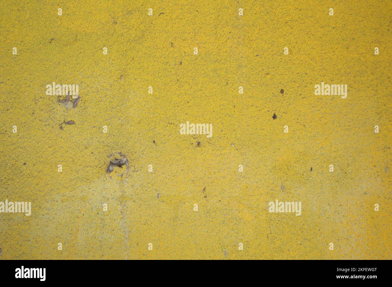 The yellow walls are dirty and old. use as wallpaper Stock Photo - Alamy