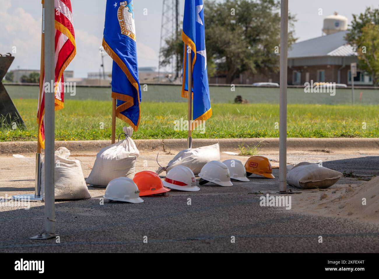 Hard hats lay on the ground during a Zone 1 ground-breaking ceremony at ...
