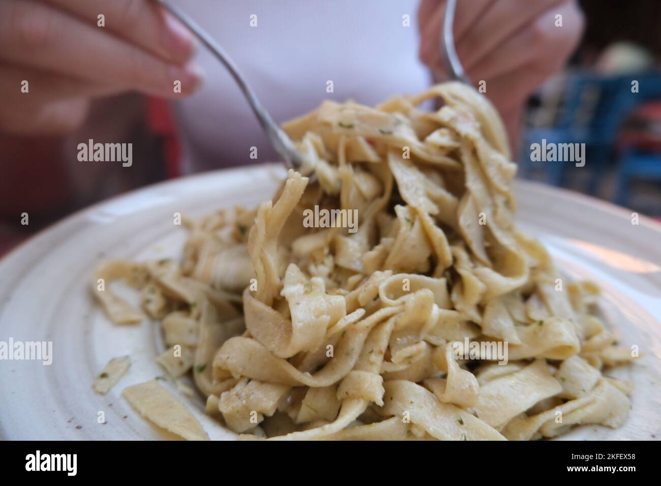 woman mixing pasta Stock Photo - Alamy