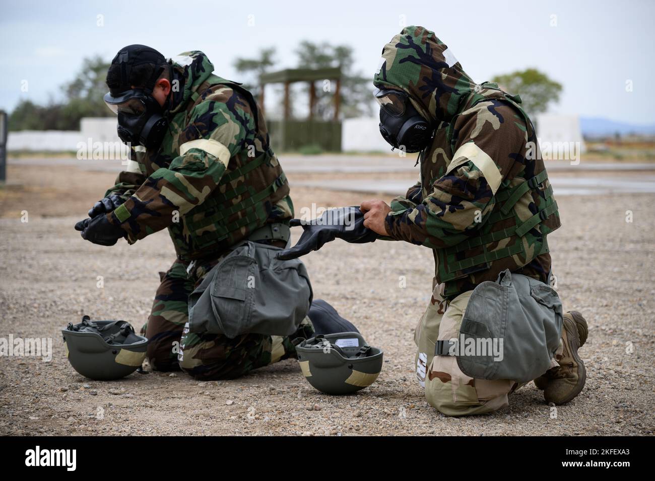 Airmen don protective gear during an Ability to Survive and Operate ...
