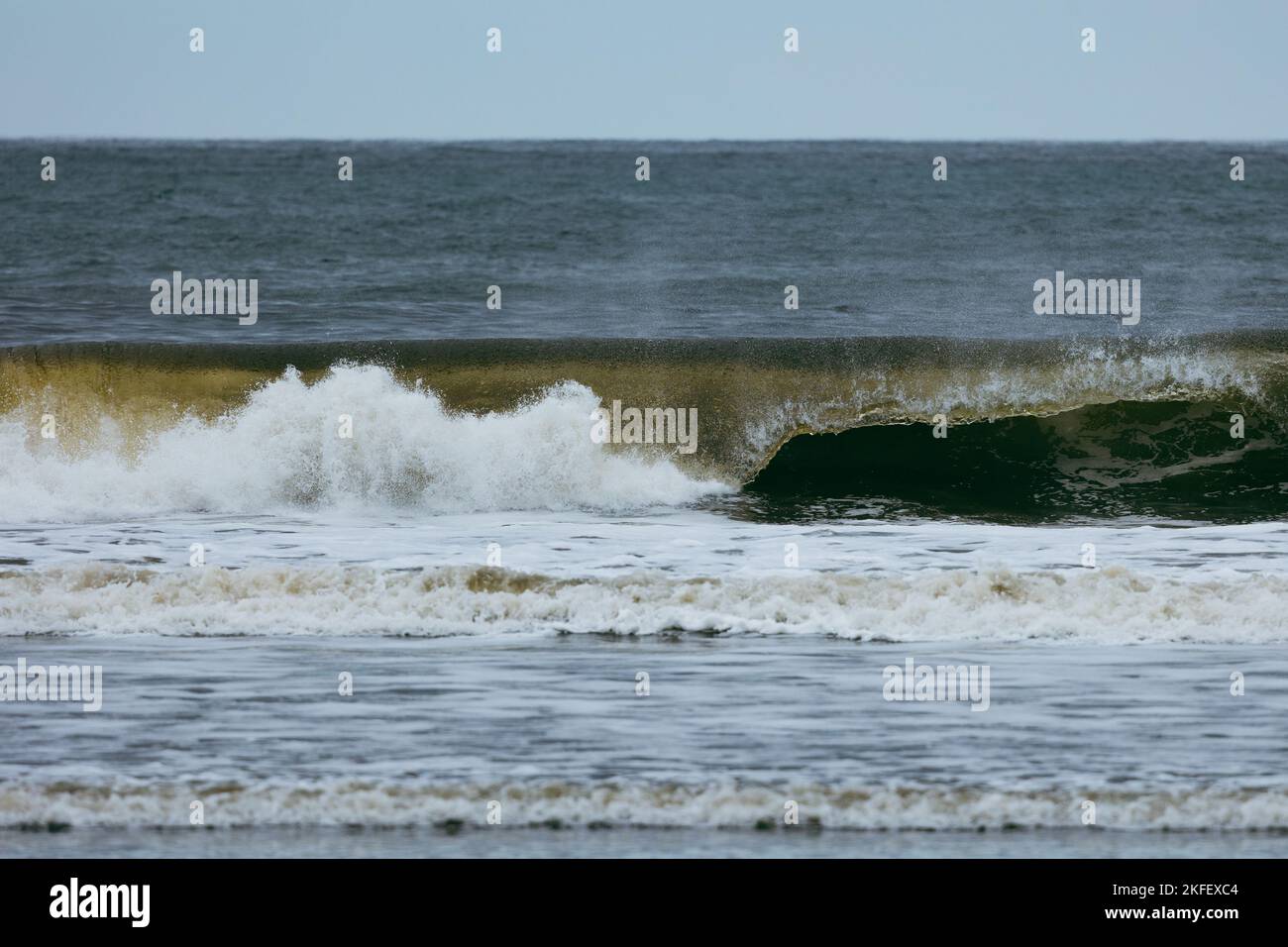 Sea waves with red tide in Costa Rica Stock Photo - Alamy