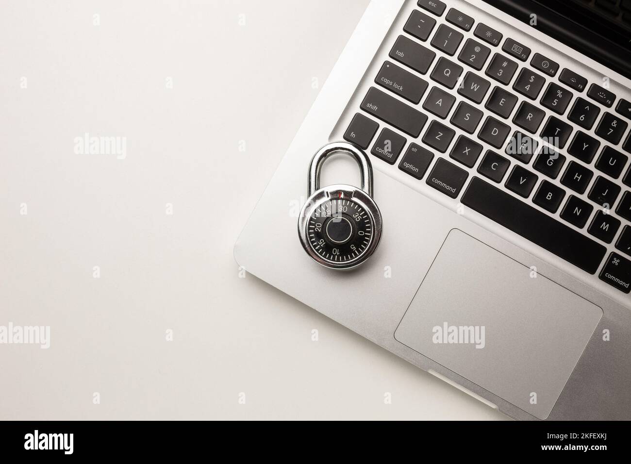 Code-locked padlock on the laptop computer. internet security and Computer security Concept ...