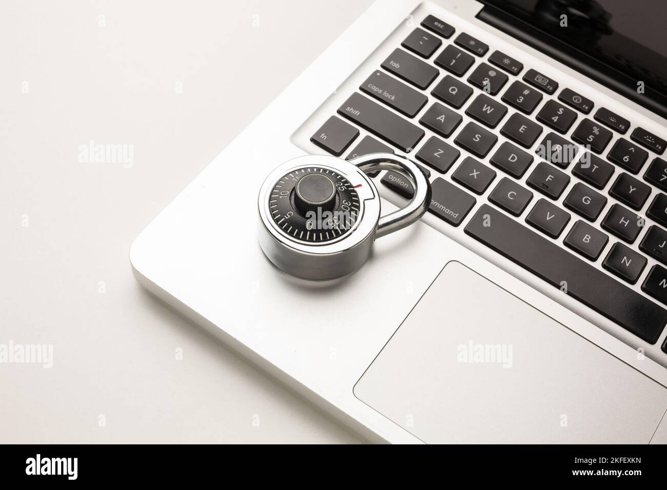 Code-locked padlock on the laptop computer. internet security and Computer security Concept ...