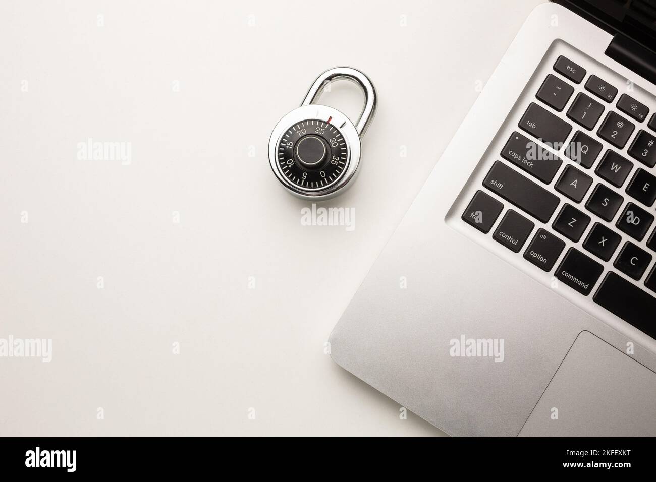 Code-locked padlock on the laptop computer. internet security and Computer security Concept ...