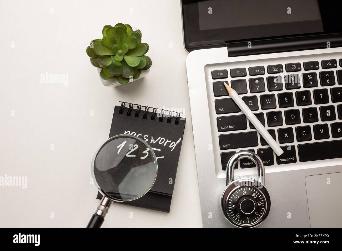 Strong steel coded lock on a laptop keyboard. IT security policies ...