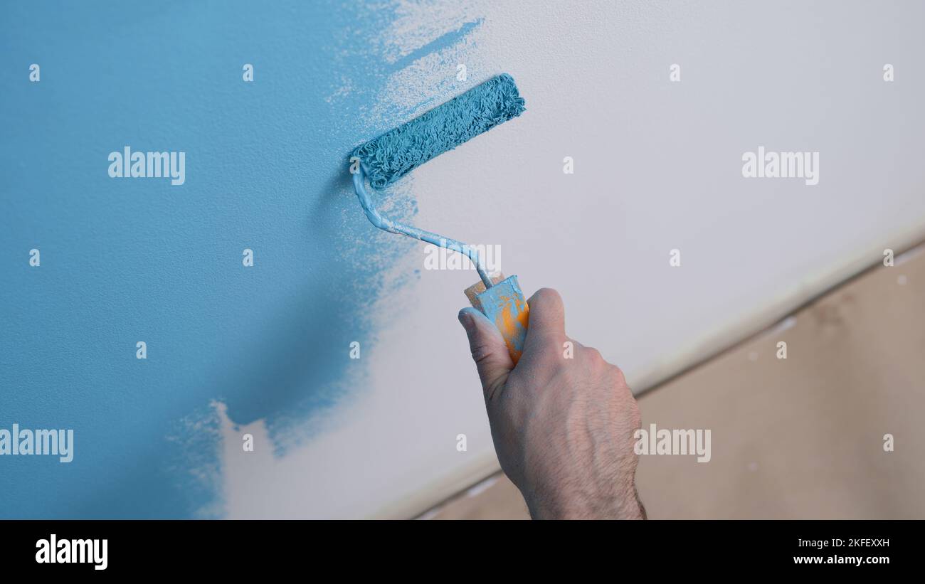 Professional painter rolling white paint hi-res stock photography and ...