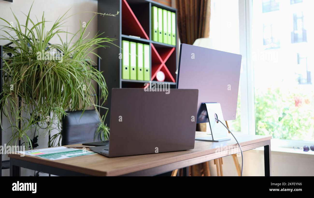 Modern workplace laptop houseplant hi-res stock photography and images ...