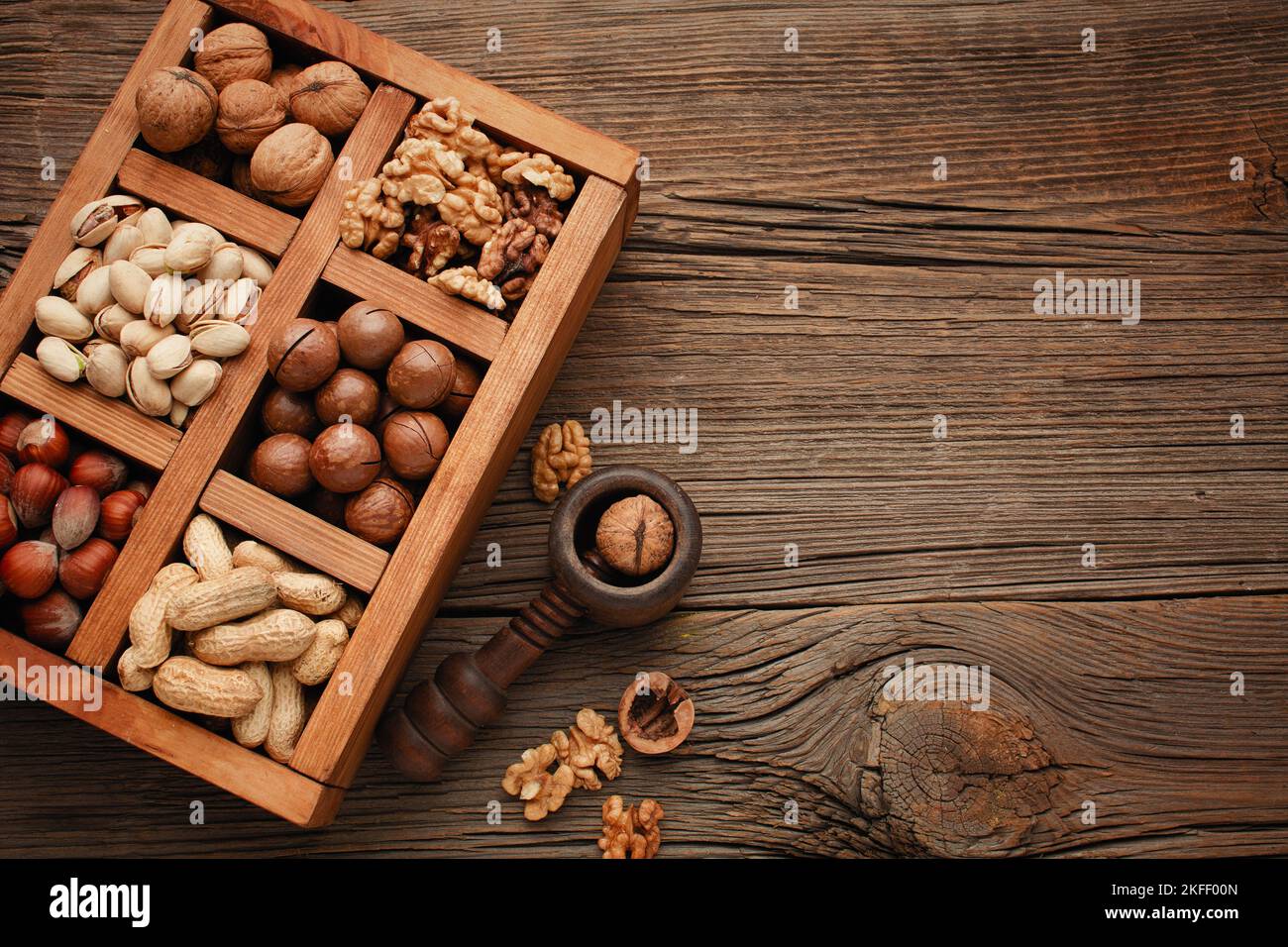 Various nuts selection: peanuts, hazelnuts, chestnuts, walnuts ...