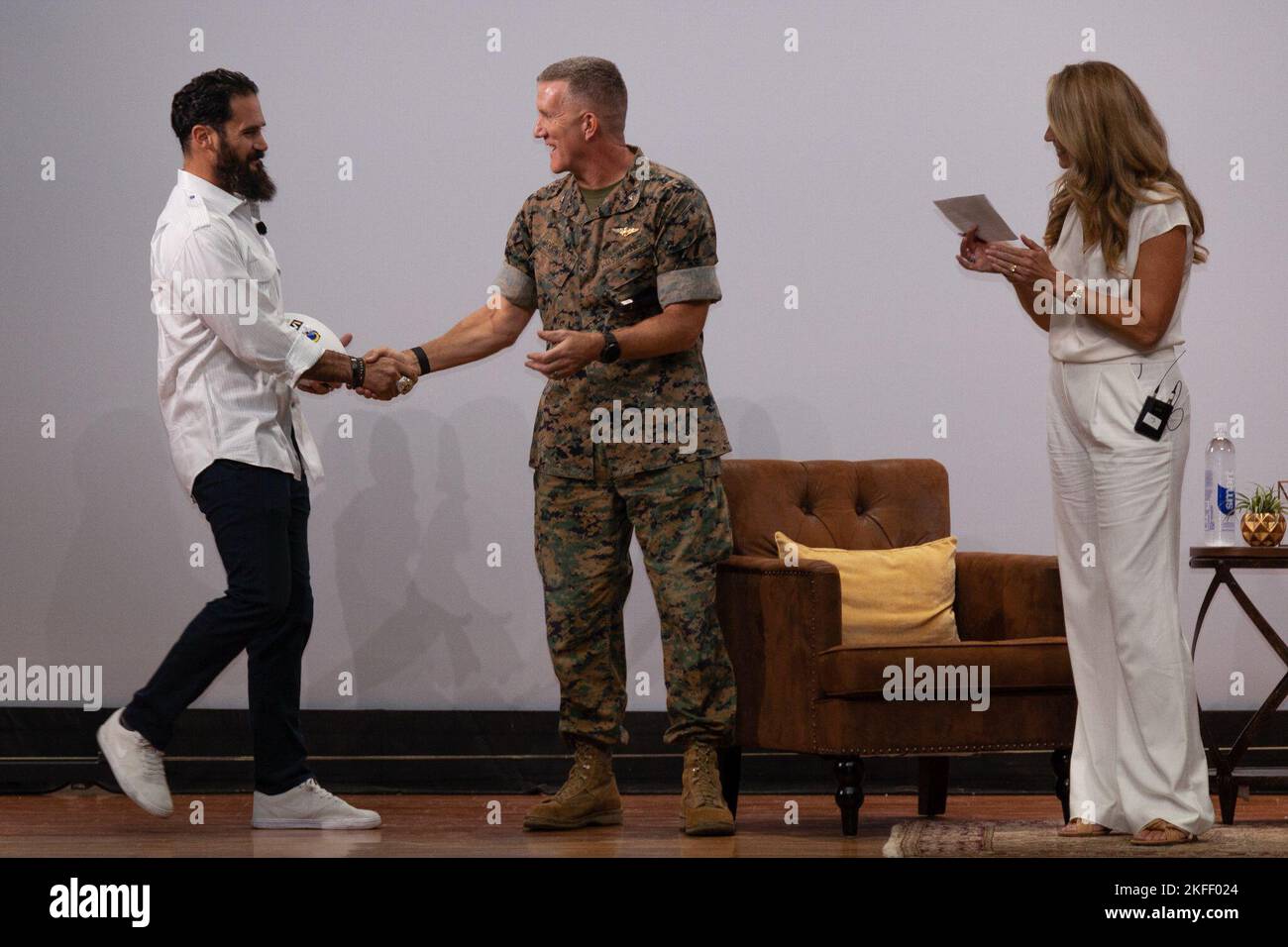 U.S. Marine Corps Brig. Gen. Jason G. Woodworth, center, the commanding ...