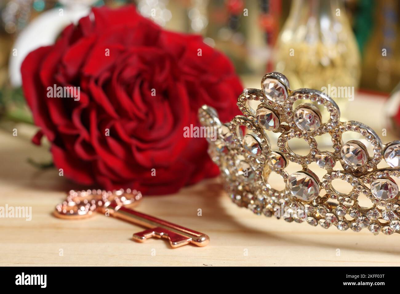 Red Rose with Key and Tiara on Dressing Table Stock Photo - Alamy