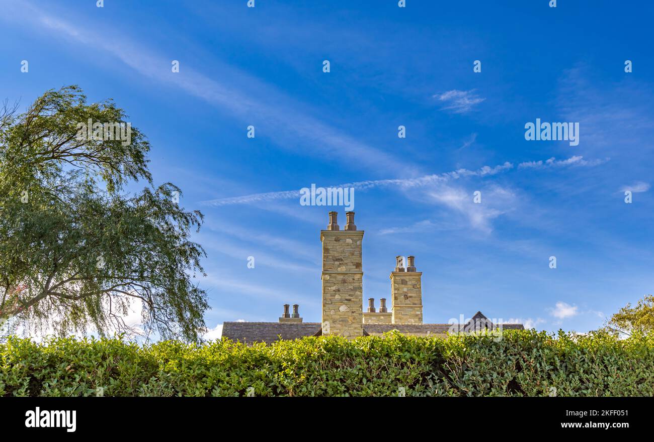 A hamptons estate behind a privet hedge Stock Photo - Alamy