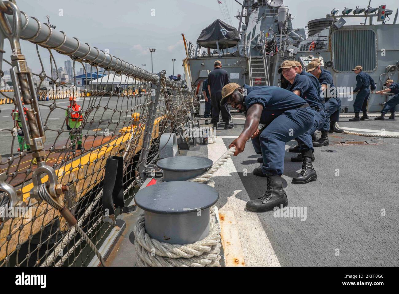 MANILA BAY (Sept. 13, 2022) Sailors secure a mooring line on the flight ...