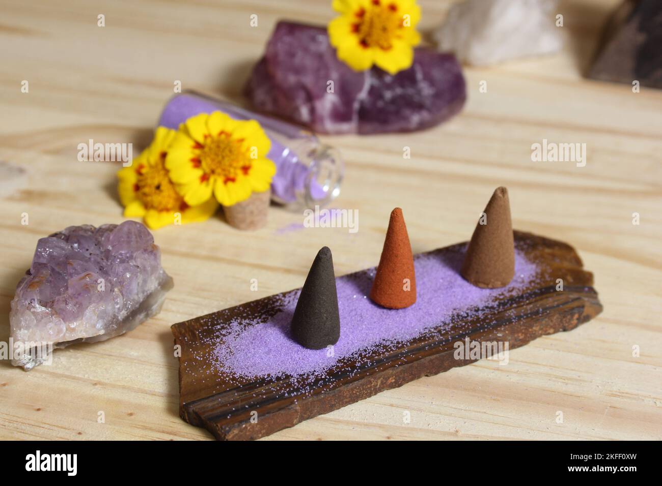 Incense Cones on Stone Slab With Rock Crystals and Flowers Stock Photo ...