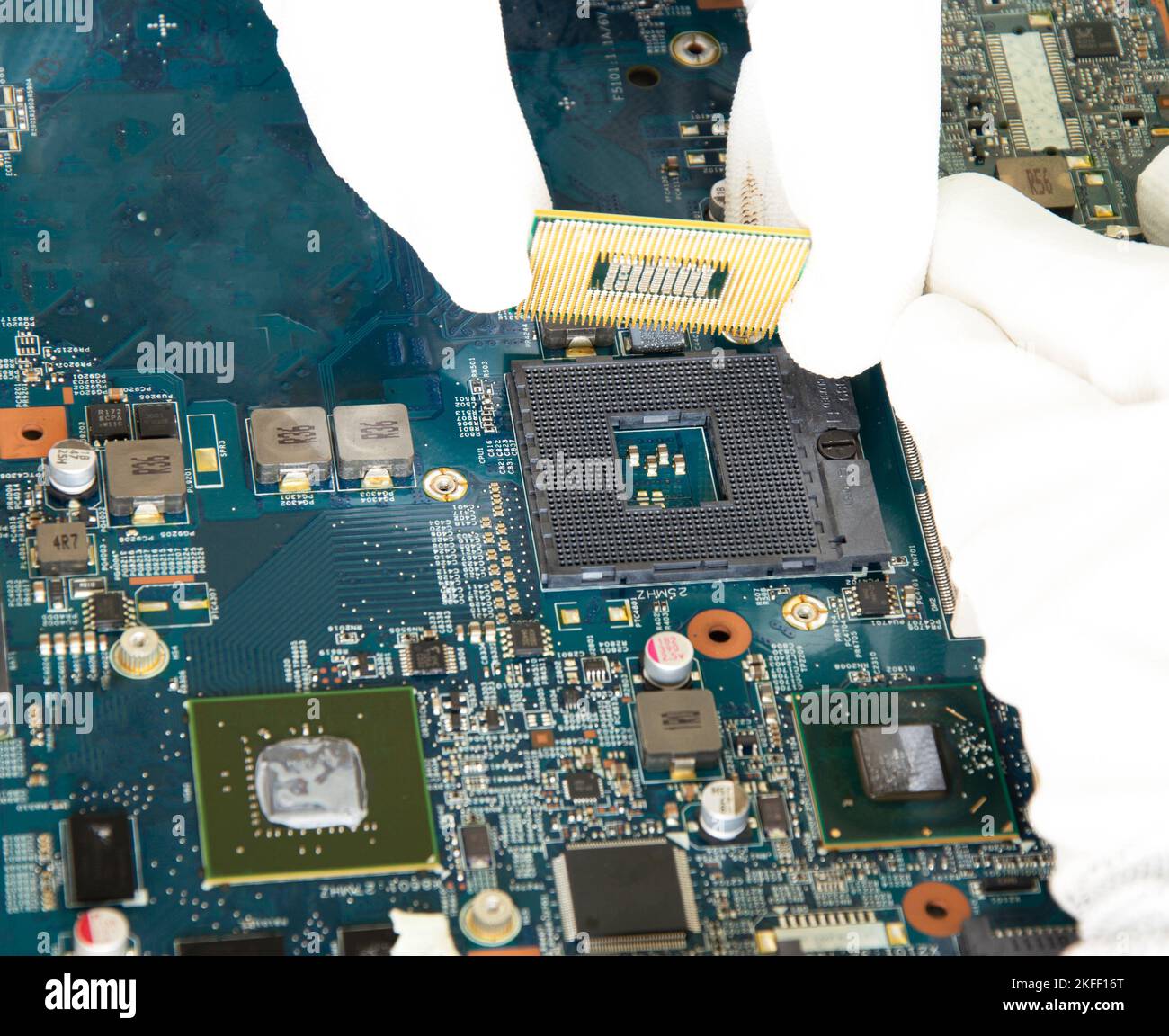 image of a mechanic repairing computer motherboard, electronic ...