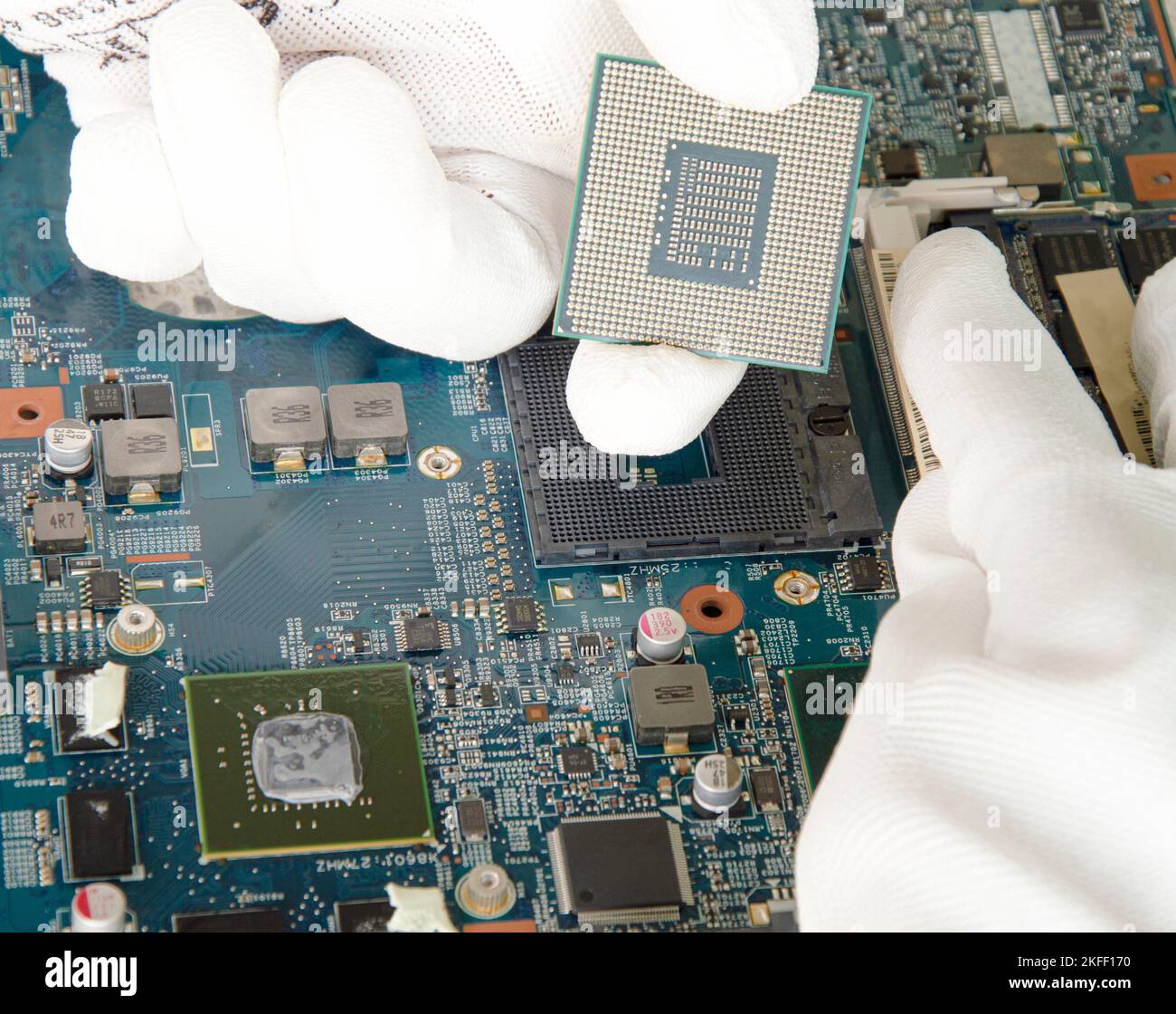 image of a mechanic repairing computer motherboard, electronic ...