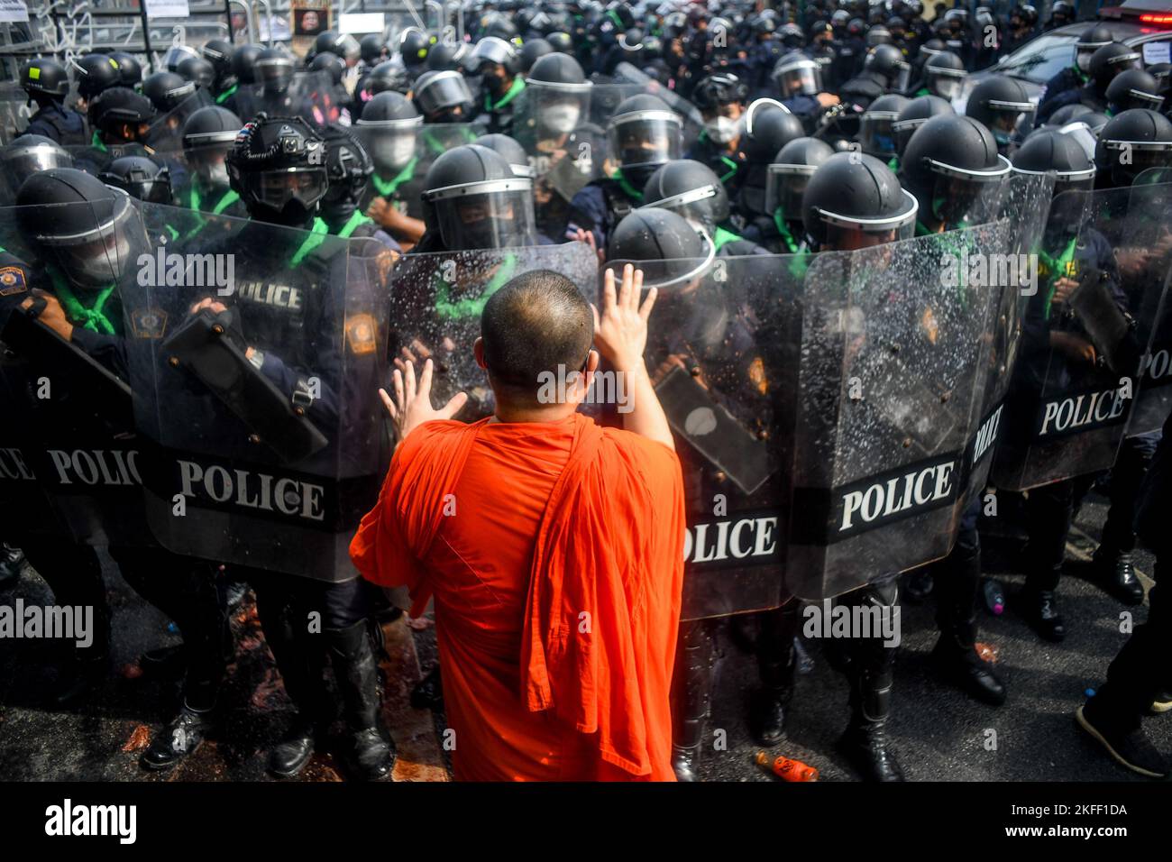 Thailand. 18th Nov, 2022. A monk negotiates with police during a group ...