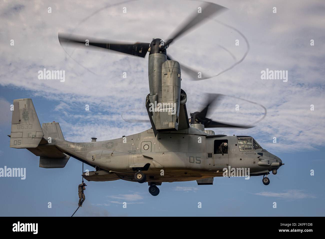 U.S. Marines with III Marine Expeditionary Force (MEF) fast rope from ...