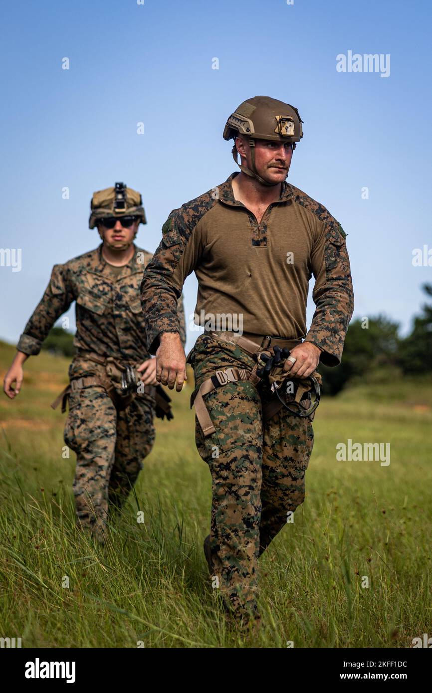 U.S. Marines with III Marine Expeditionary Force (MEF) approach an MV ...