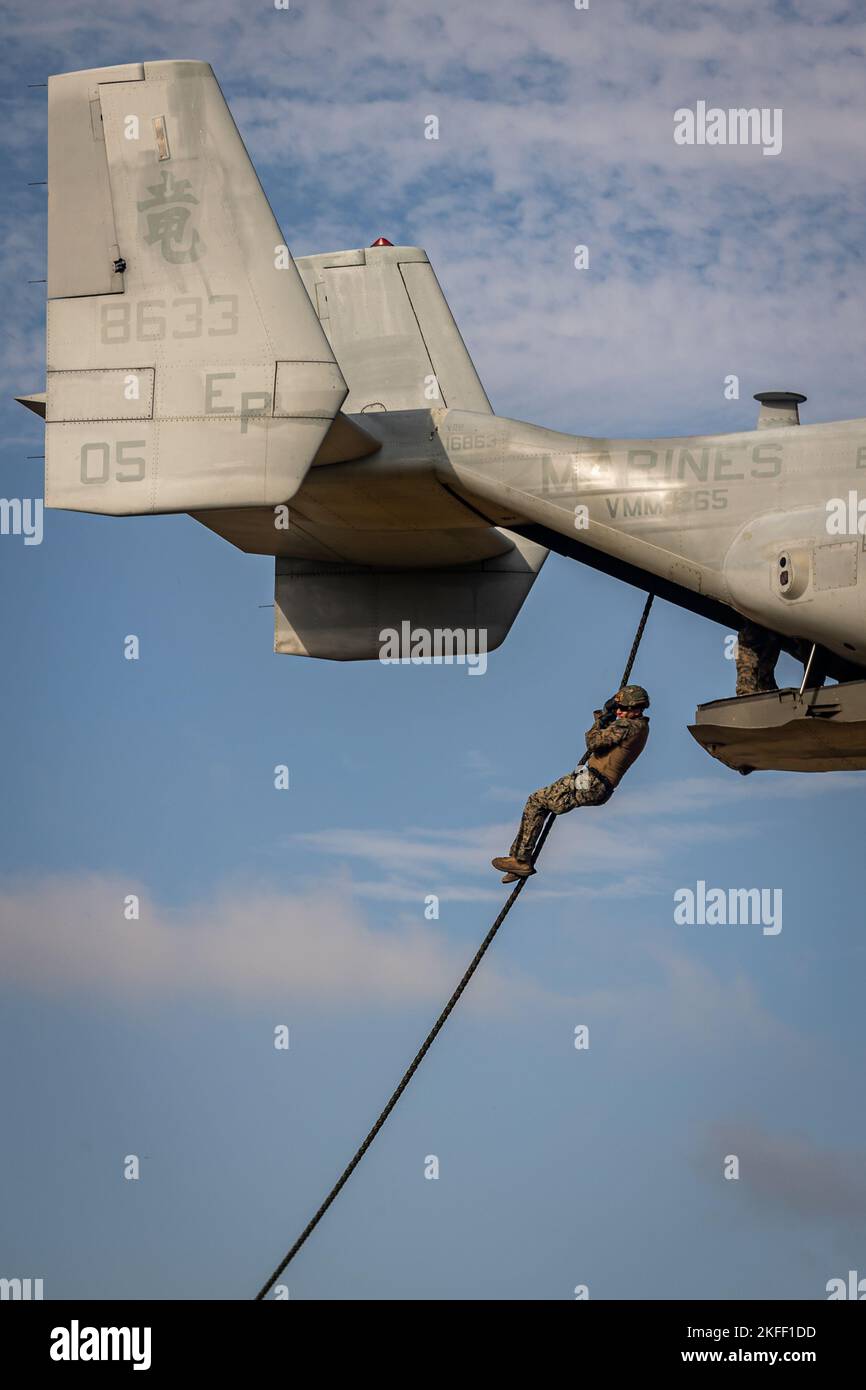 U.S. Marines with III Marine Expeditionary Force (MEF) fast rope from ...