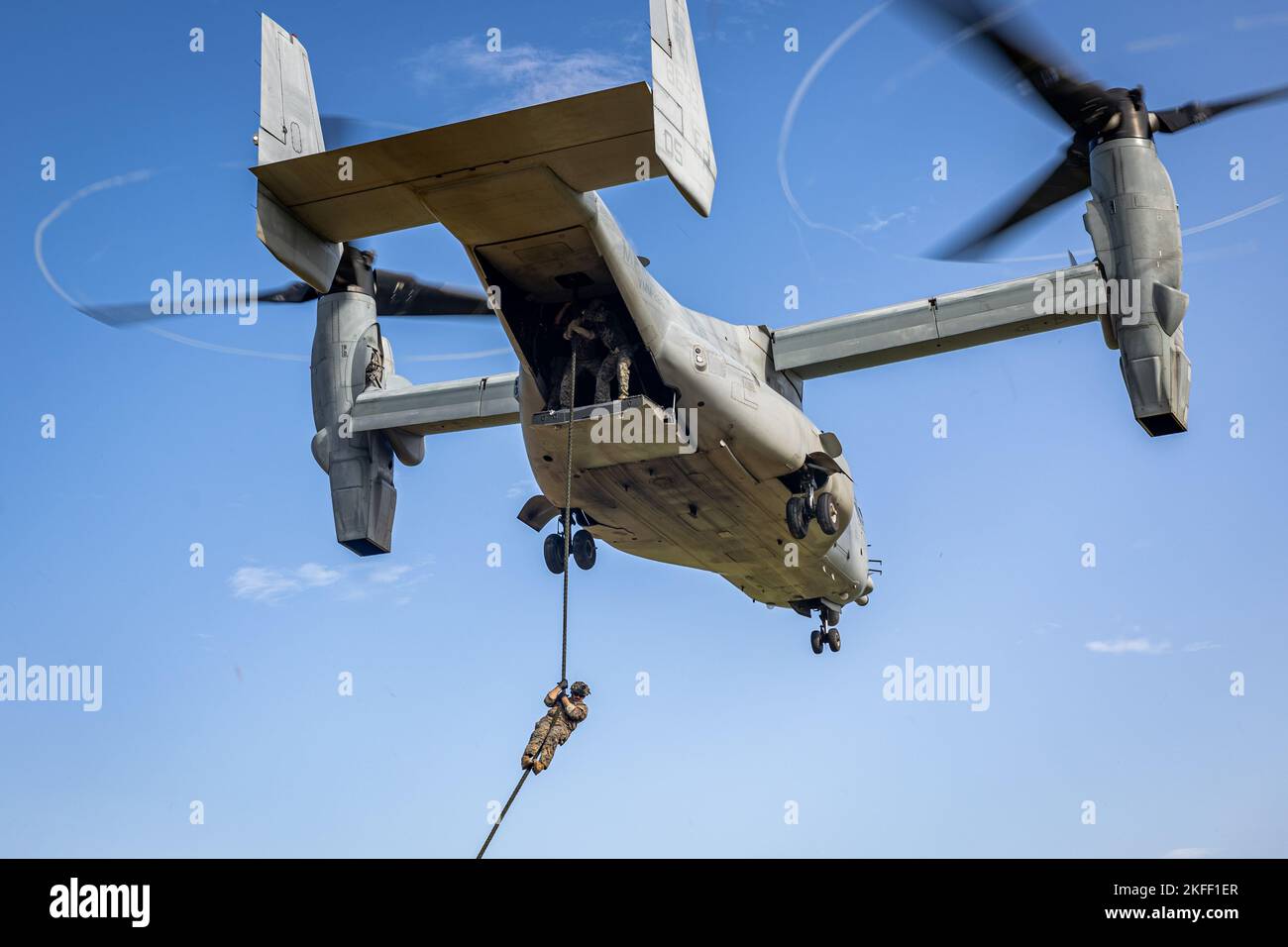 U.S. Marines with III Marine Expeditionary Force (MEF) fast rope from ...