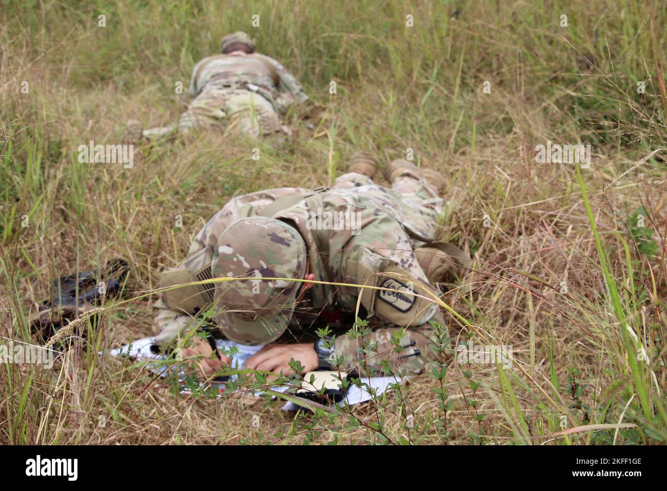 Candidates plot points on their map during the Land Nav Course Stock ...