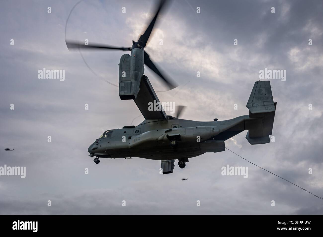 U.S. Marines with III Marine Expeditionary Force (MEF) rappel from an ...
