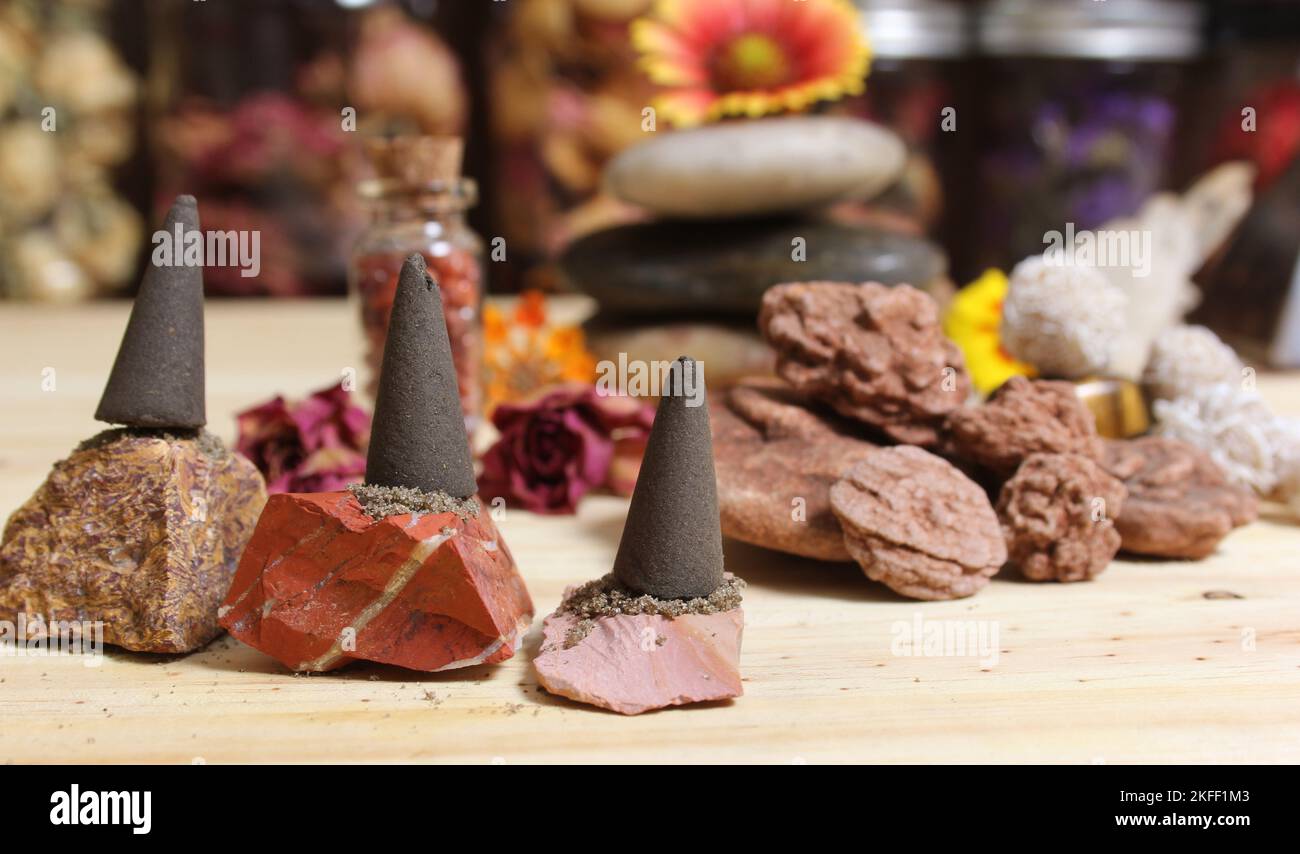 Incense Cones and Desert Rose Rocks on Meditation Table With Pyramid in ...