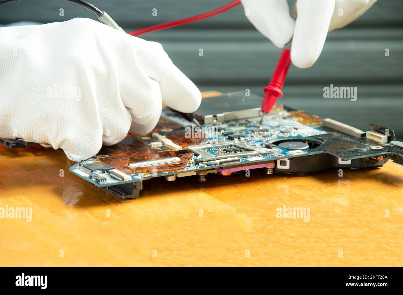 side view mechanic repairing motherboard Stock Photo - Alamy