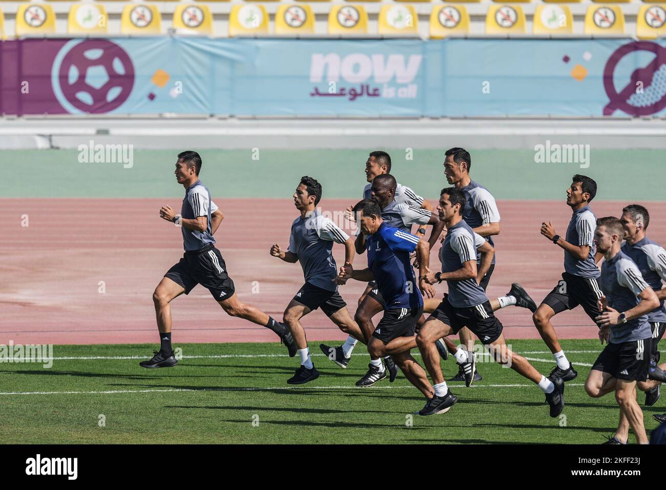 Doha, Qatar. 18th Nov, 2022. Chinese referee Ma Ning (1st L) attends a ...