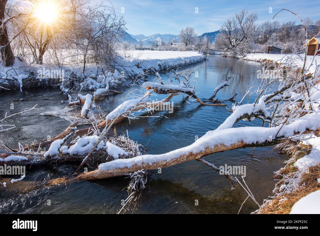 landscape in winter with mountain range and river Stock Photo - Alamy