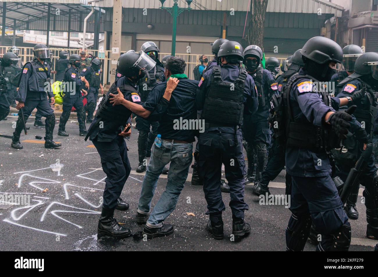 Bangkok, Thailand - 18 Nov 2022, Riot police arrest a protester during ...