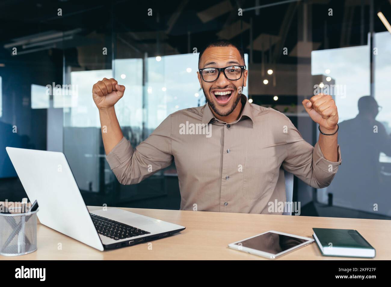 Happy and successful businessman celebrating achievement, portrait of ...