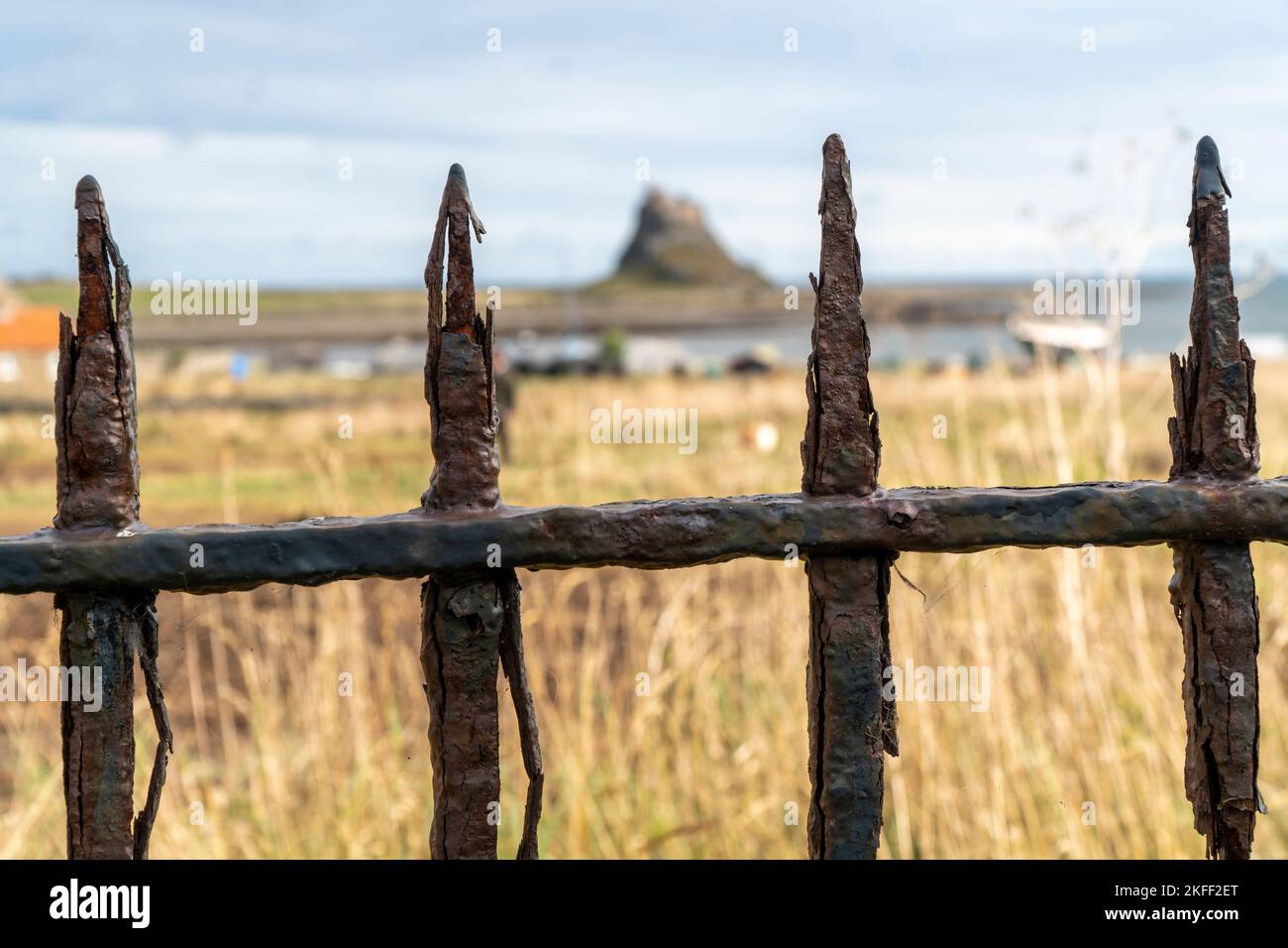Lindisfarne castle through rusty railings hi-res stock photography and ...