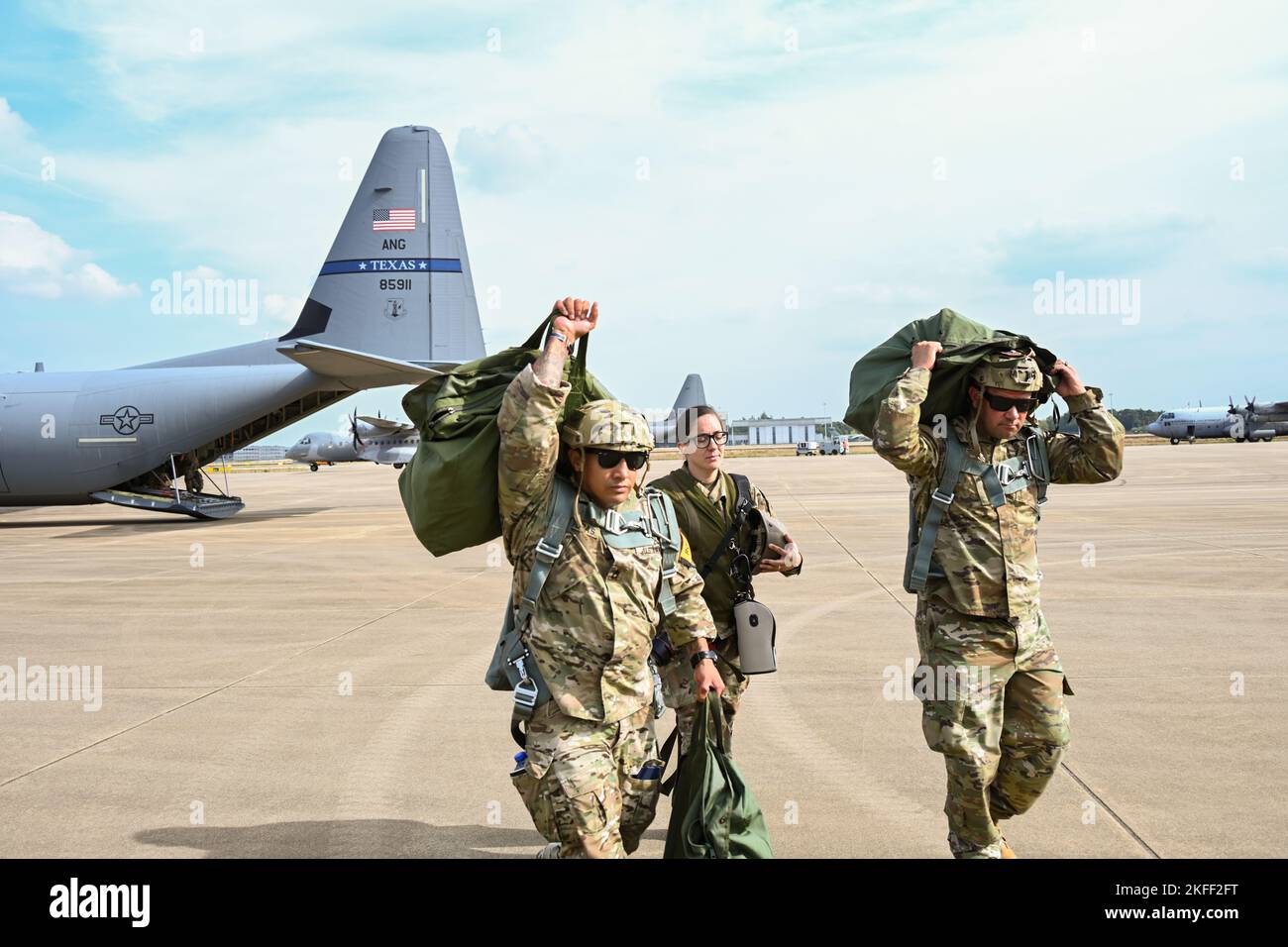 Army Airborne rigger team exit 136th Airlift Wings' C-130 J Model ...