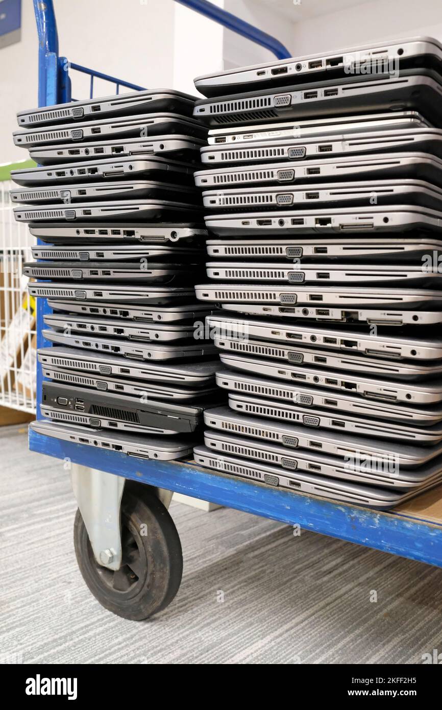 Big stacks of discarded laptops, notebooks on a trolley Stock Photo - Alamy