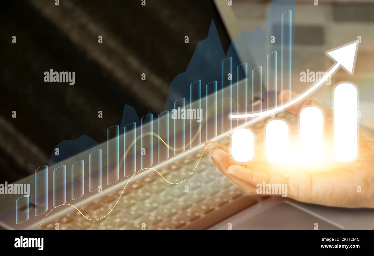 Hand holding a rising arrow, representing business growth Stock Photo ...