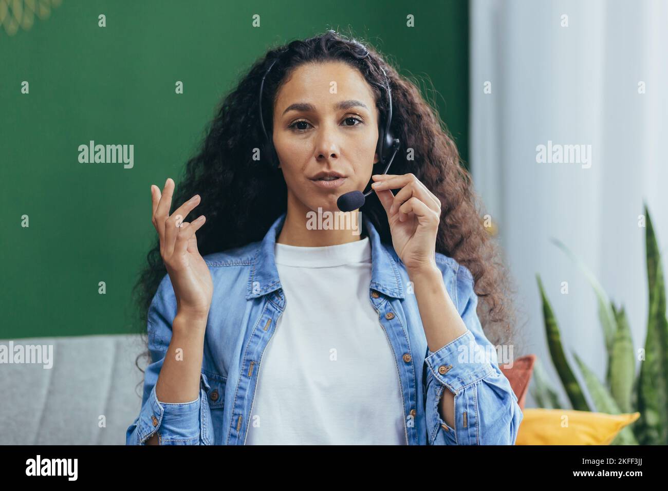 Woman talking into microphone hi-res stock photography and images - Alamy