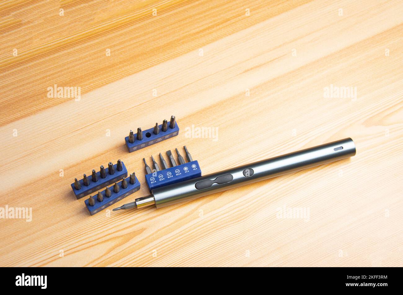 Picture of a mini electric screwdriver, interchangeable tip, placed on ...