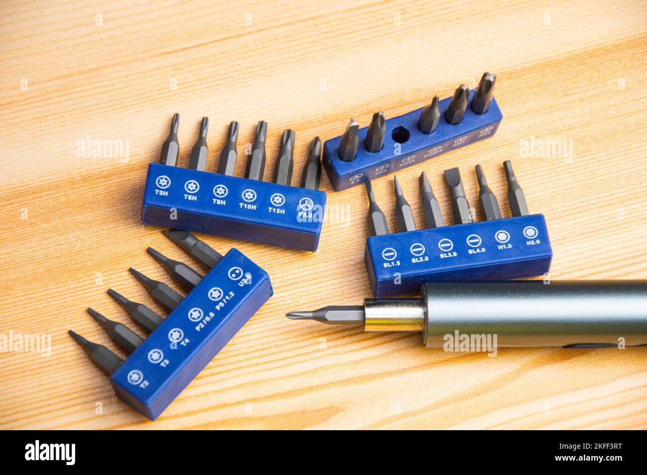 Picture of a mini electric screwdriver, interchangeable tip, placed on ...