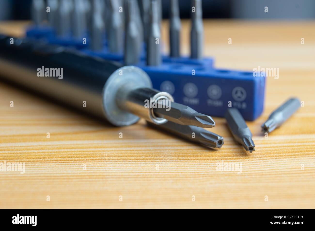 Picture of a mini electric screwdriver, interchangeable tip, placed on ...
