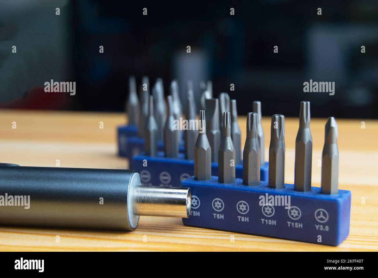 Picture of a mini electric screwdriver, interchangeable tip, placed on ...