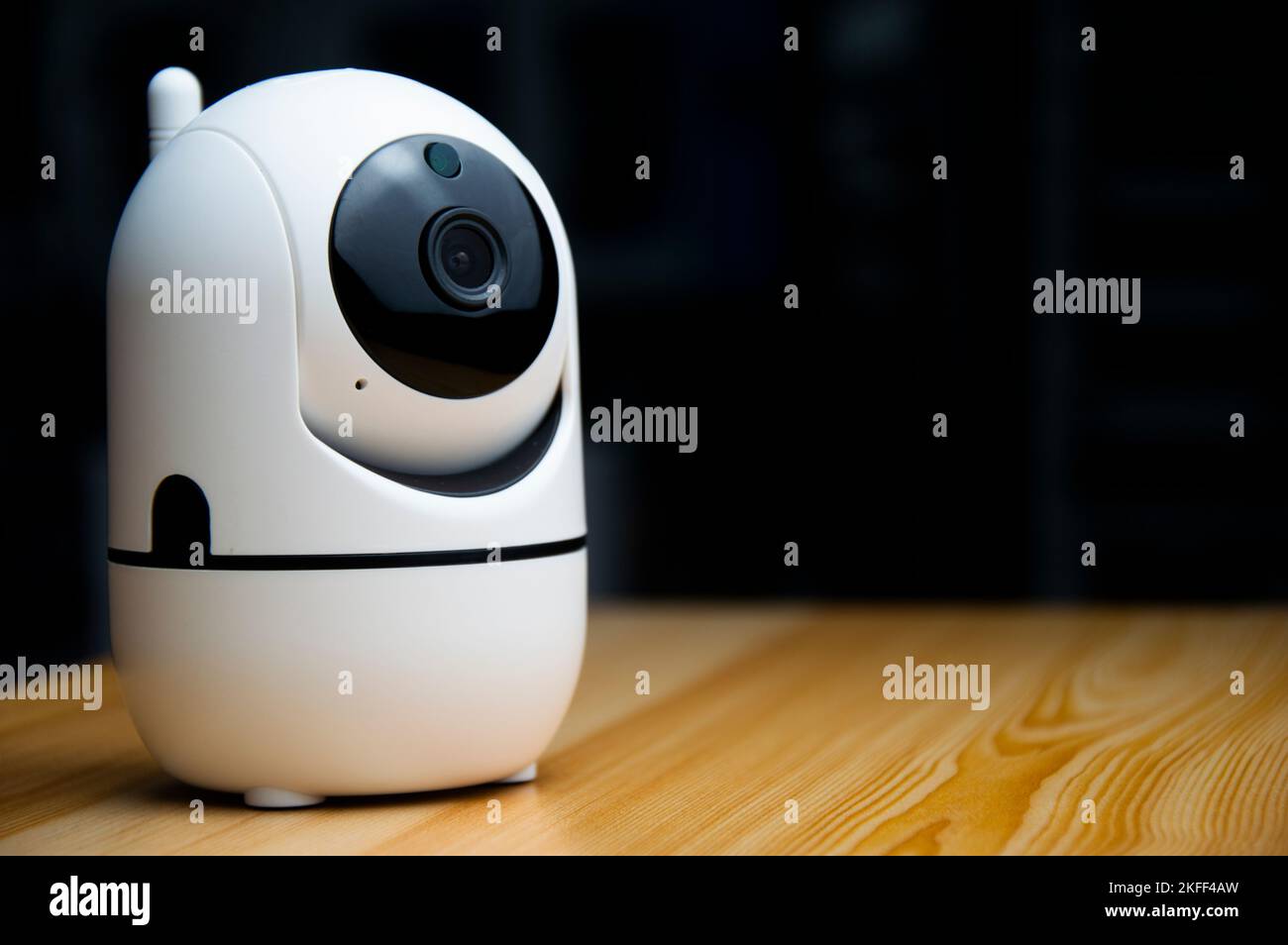 White IP camera placed on wooden floor Stock Photo - Alamy