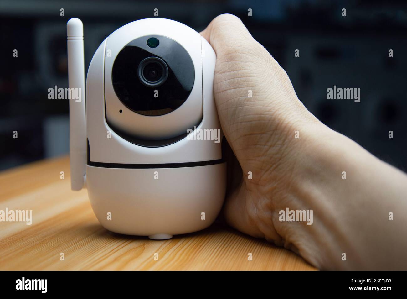 White IP camera placed on wooden floor Stock Photo - Alamy