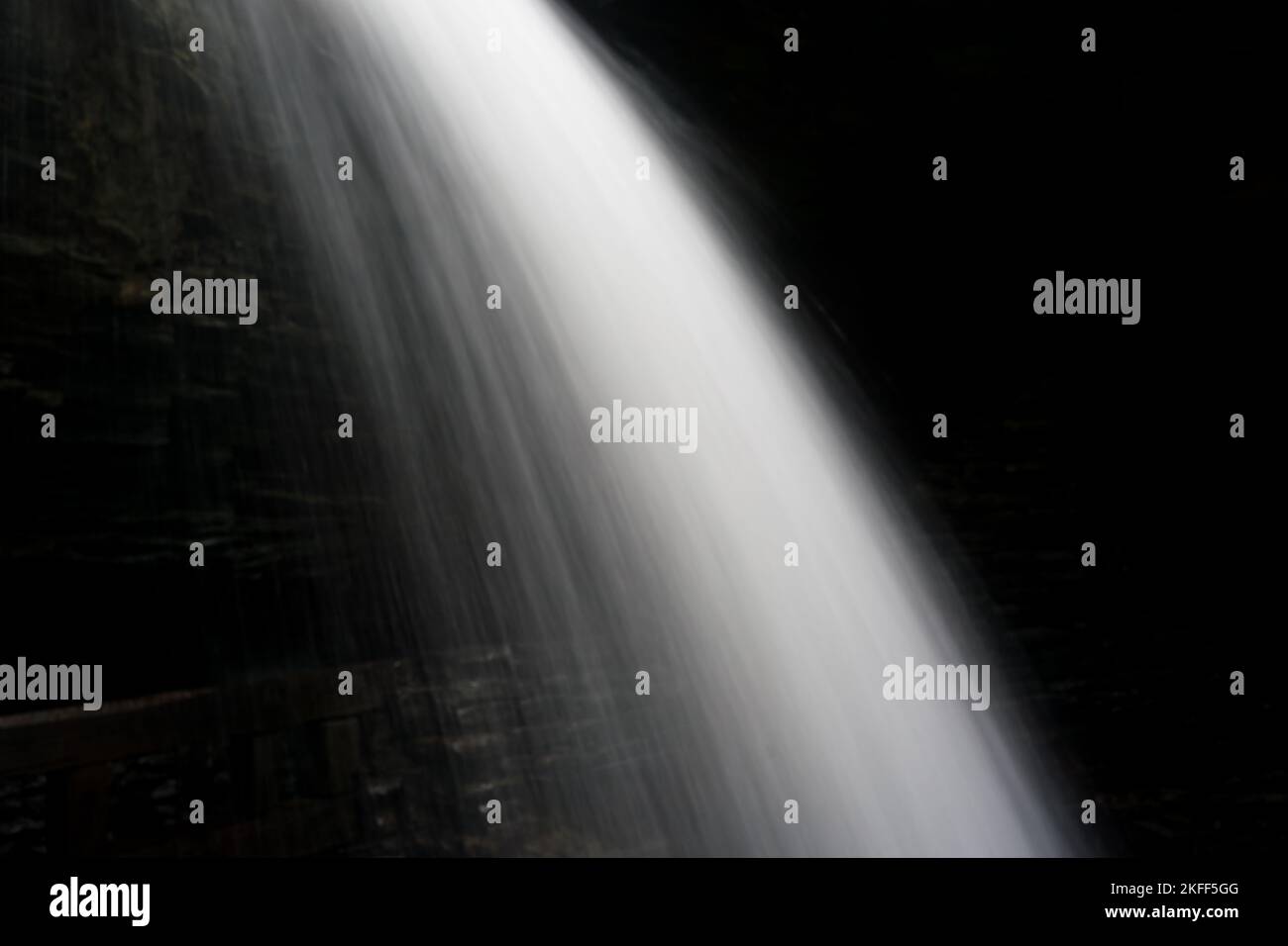 Waterfall flowing out into empty space Stock Photo - Alamy