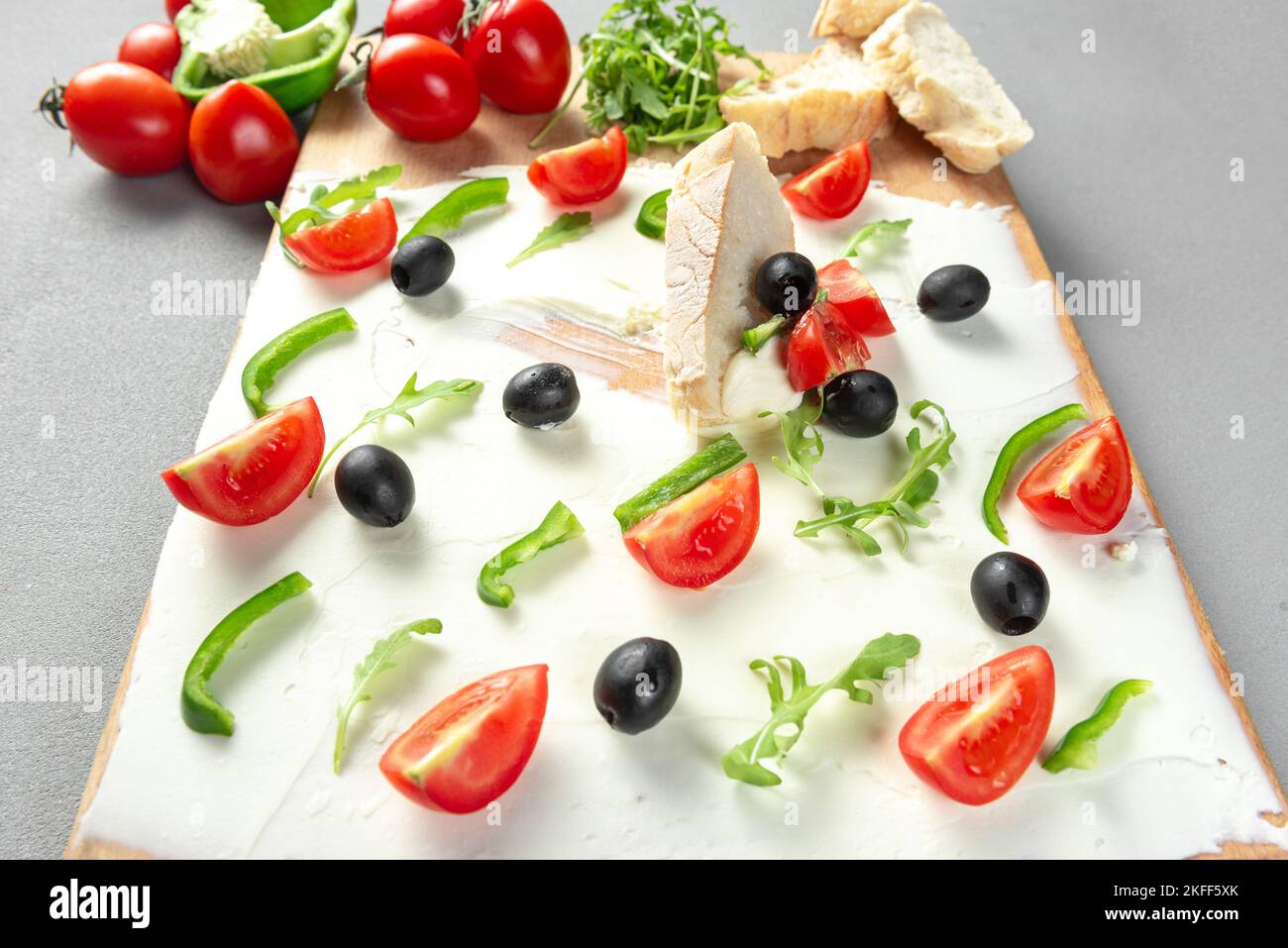 A food trend, bread with butter and toppings. Board with butter snack ...