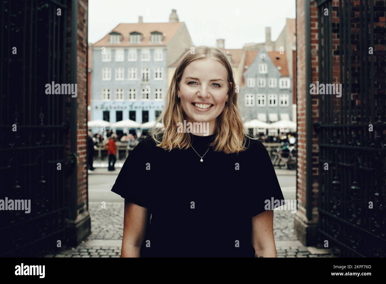 A beautiful blonde Caucasian woman portrait smiling at the camera in ...